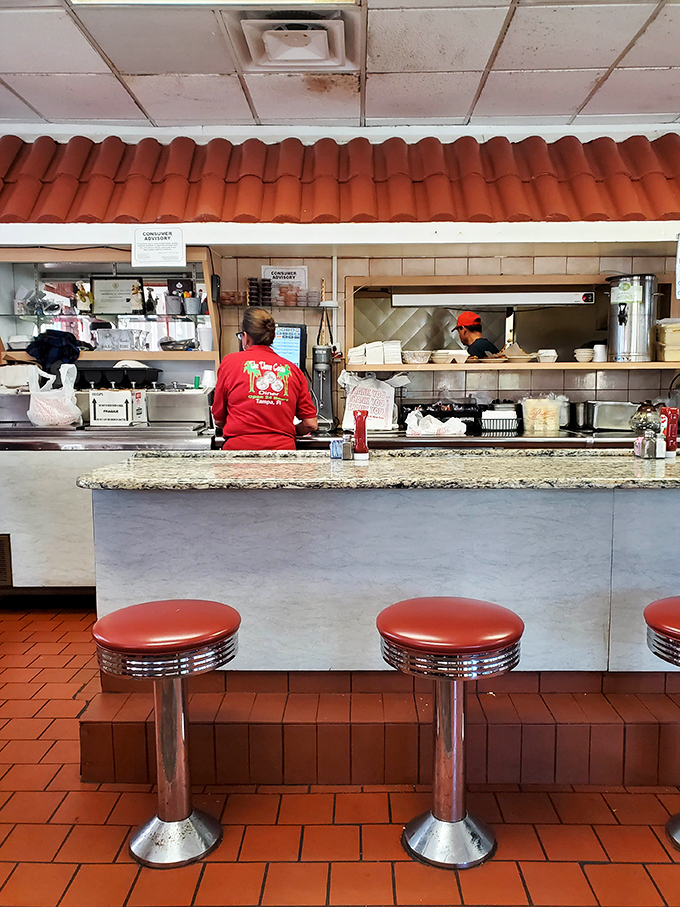 The terra cotta floor and counter dividers create little dining islands&mdash;each one a potential setting for your next favorite meal memory.
