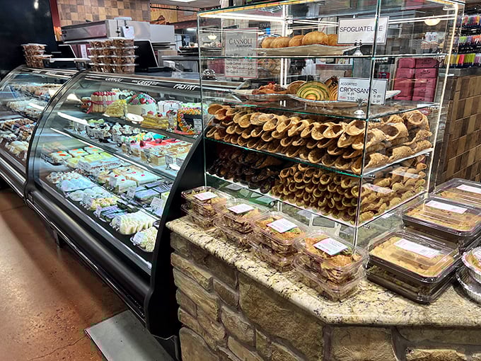 The pastry case and cannoli display&mdash;where willpower goes to die and happiness begins. Those cream-filled tubes are basically joy in edible form.