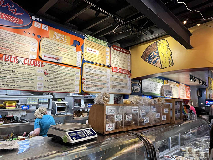 Behind this counter, sandwich magic happens. It's like watching Olympic athletes, except the gold medals are made of pastrami.
