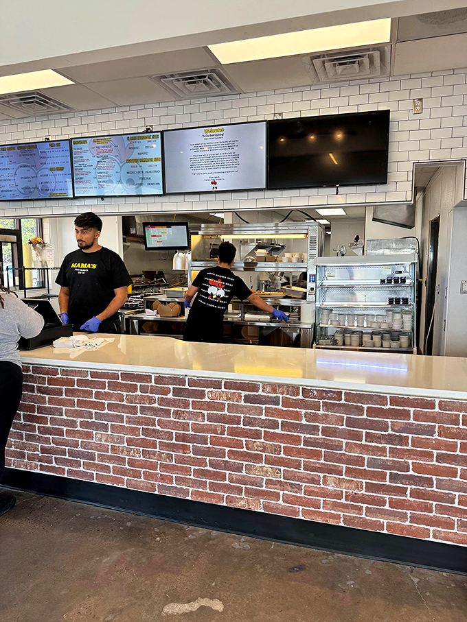 Where chicken dreams come true—staff in their element, ready to deliver that perfect crunch you've been thinking about all day.