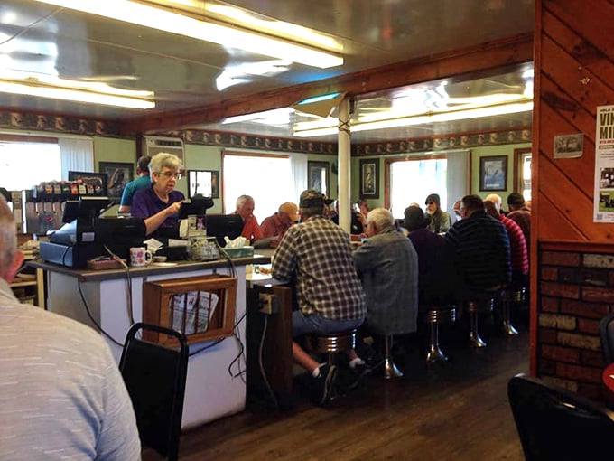 The counter where magic happens, surrounded by those classic diner stools that have supported generations of hungry Wisconsinites.