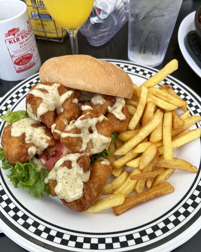 This shrimp po' boy isn't just a sandwich; it's a declaration that seafood belongs between bread with a generous splash of sauce. 