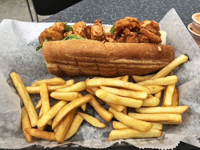 This po' boy is rich in flavor&mdash;crispy shrimp nestled in a perfect roll with a mountain of fries that demands to be devoured immediately.