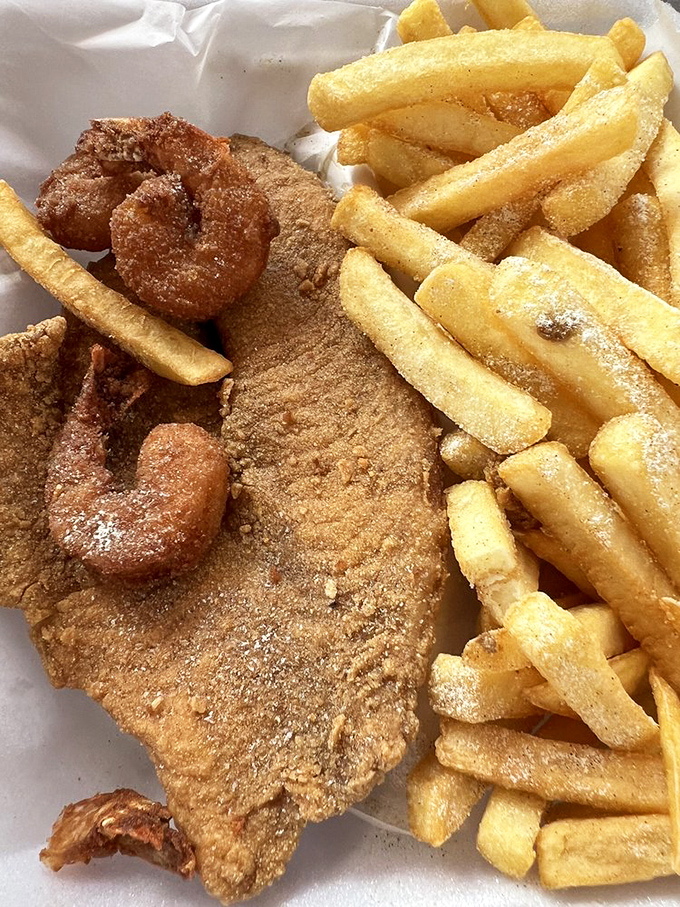 Shrimp and fish cohabiting peacefully, proving that surf and turf's cousin, surf and surf, deserves equal recognition.