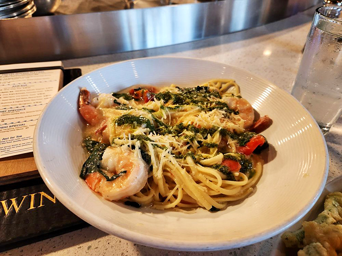 Shrimp scampi pasta where every twirl of your fork captures garlic-kissed noodles and plump shrimp&mdash;carb heaven with a seafood upgrade.