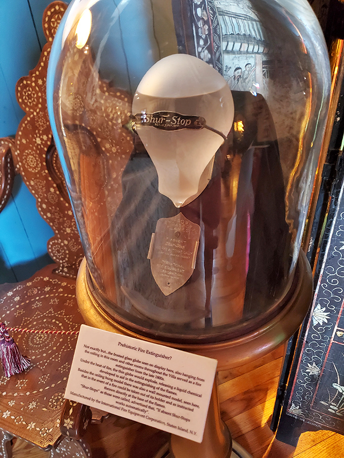 The "Shur-Stop" fire extinguisher under glass&mdash;vintage safety equipment so beautiful you'd almost welcome a small, controllable blaze just to use it.