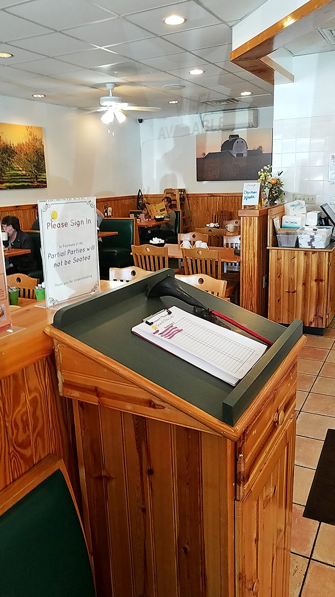 Please sign in&mdash;three words that stand between you and breakfast nirvana. The clipboard guardian of morning happiness.