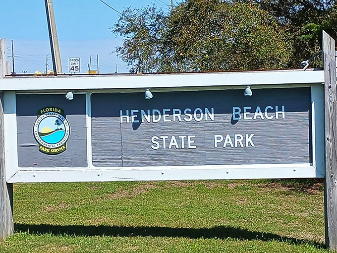 The park's entrance sign welcomes visitors with the simplicity of blue and white&mdash;Florida's official colors of "relax, you're here now."