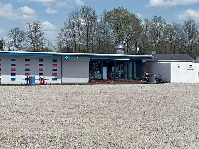 The concession stand—where movie theater economics really happen. Those orange countertops have supported countless buckets of popcorn and boxes of candy.
