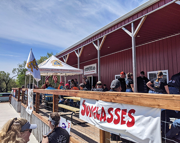 This gathering spot combines the timeless appeal of wooden railings with the modern necessity of a good banner. Small-town event planning at its finest.