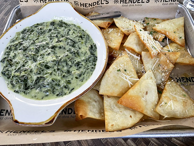 Spinach artichoke dip and crispy pita triangles &ndash; the appetizer equivalent of a perfect first date: warm, cheesy, and leaves you wanting more.