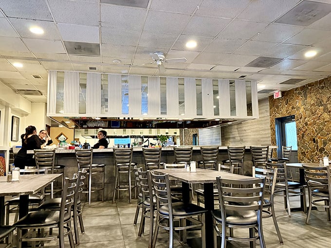 Where the magic happens: the open kitchen design lets you witness the choreography of short-order cooking at its finest.