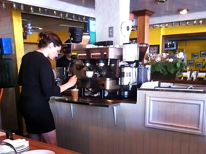 Where coffee magic happens. The barista's morning choreography turns caffeine into an art form for sleepy Angelenos.