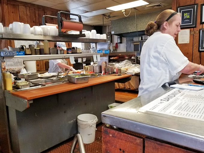 Behind every legendary sandwich is someone who's mastered the art of assembly, turning ordinary ingredients into extraordinary meals with practiced hands.