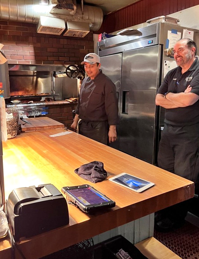 The kitchen staff's knowing smiles suggest they've heard every "best steak ever" compliment but still appreciate each one.