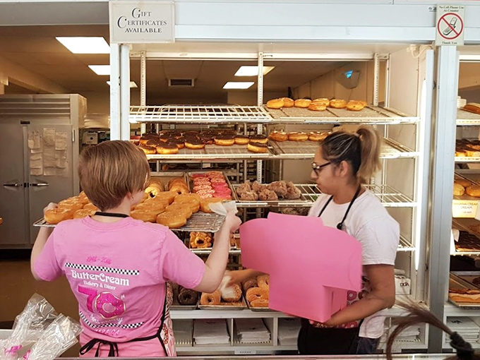 Pink boxes in hand, these staff members are literally delivering happiness. Not all heroes wear capes.