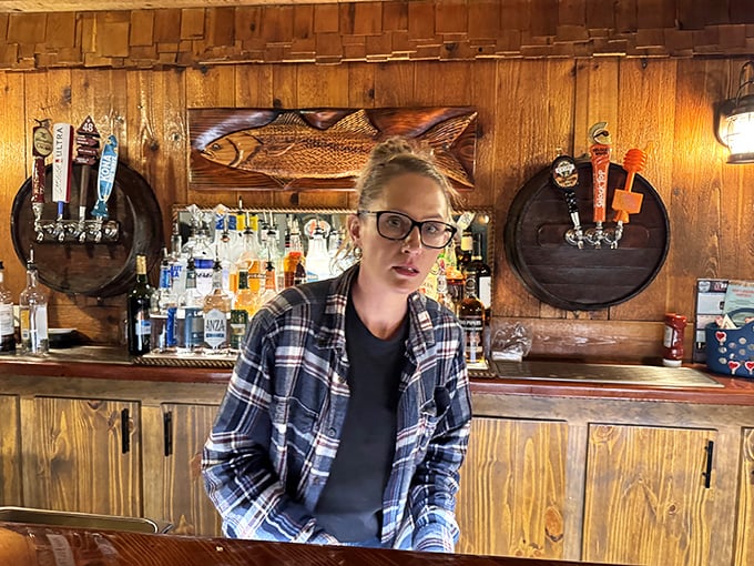 Behind every great seafood restaurant is a staff who knows their grouper from their snapper. The wooden bar backdrop showcases Florida's fishing heritage.