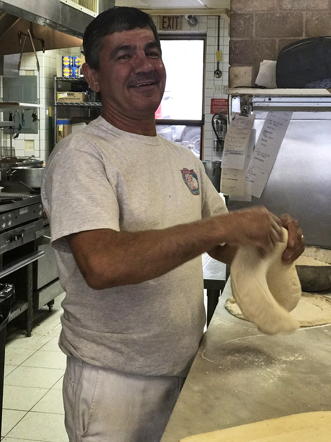 The magic happens in the hands of dedicated pizza artisans who've perfected their dough-tossing technique through years of passionate practice.