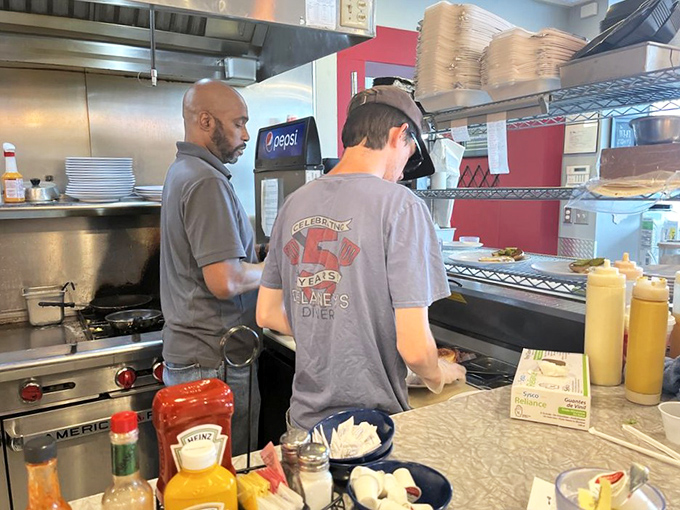 Where the magic happens&mdash;skilled hands working the grill with the precision of orchestra conductors. Breakfast is serious business here.