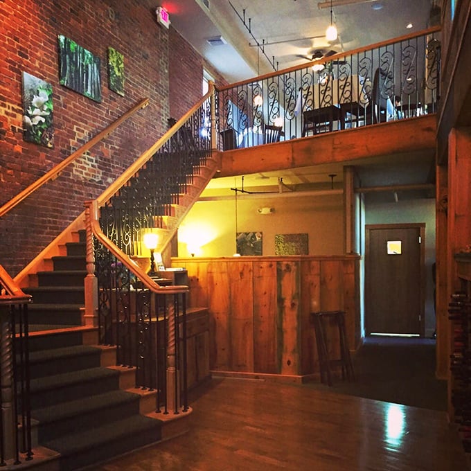Stairway to heaven? Close enough. These wooden steps with wrought iron railings lead to the mezzanine level where dining becomes an elevated experience&mdash;literally.