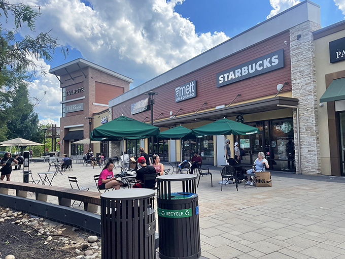 Starbucks' outdoor seating creates the perfect perch for people-watching and plotting which stores to hit next, fueled by liquid motivation.