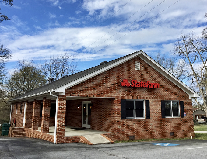 The brick State Farm office looks so quintessentially small-town American, you half expect Andy Griffith to stroll out whistling the Mayberry theme.