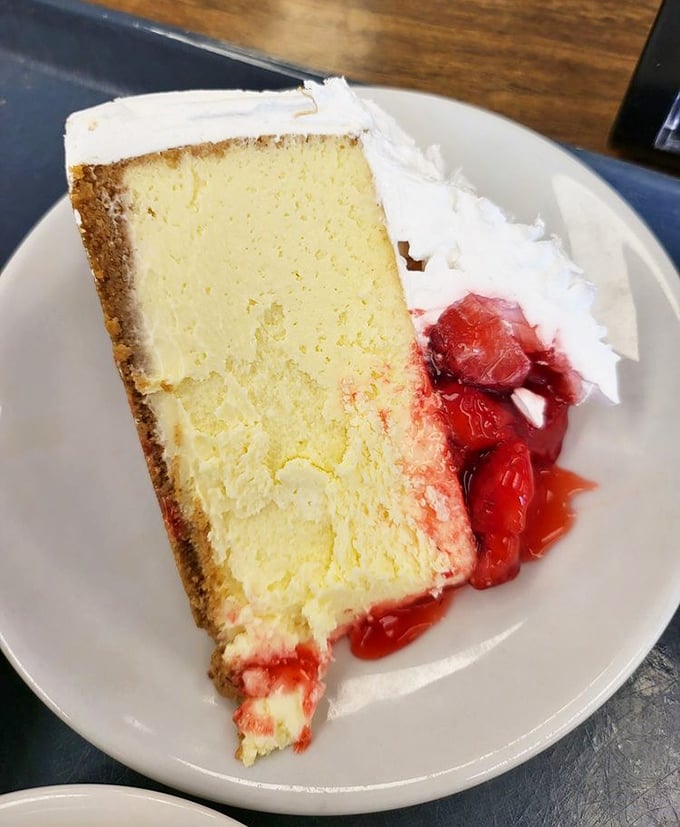 Cheesecake with strawberries that makes you wonder why you'd ever waste calories on lesser desserts. Dense, creamy perfection that demands your full attention.