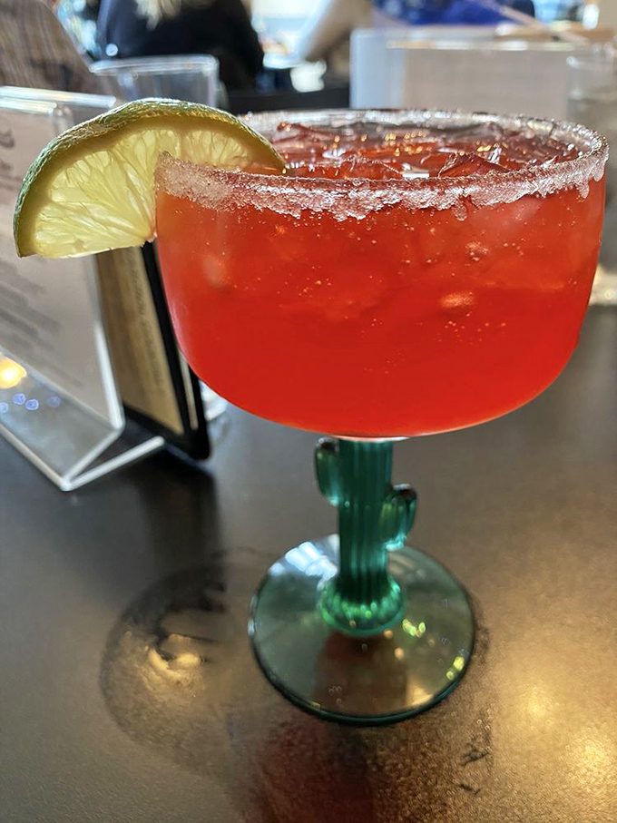 A margarita that looks like liquid sunset in a cactus glass. This isn't just a drink&mdash;it's vacation in stemware form.