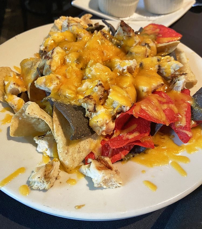 Nachos that defy gravity and good sense&mdash;a mountain of melted cheese, chips, and toppings that demands to be conquered.