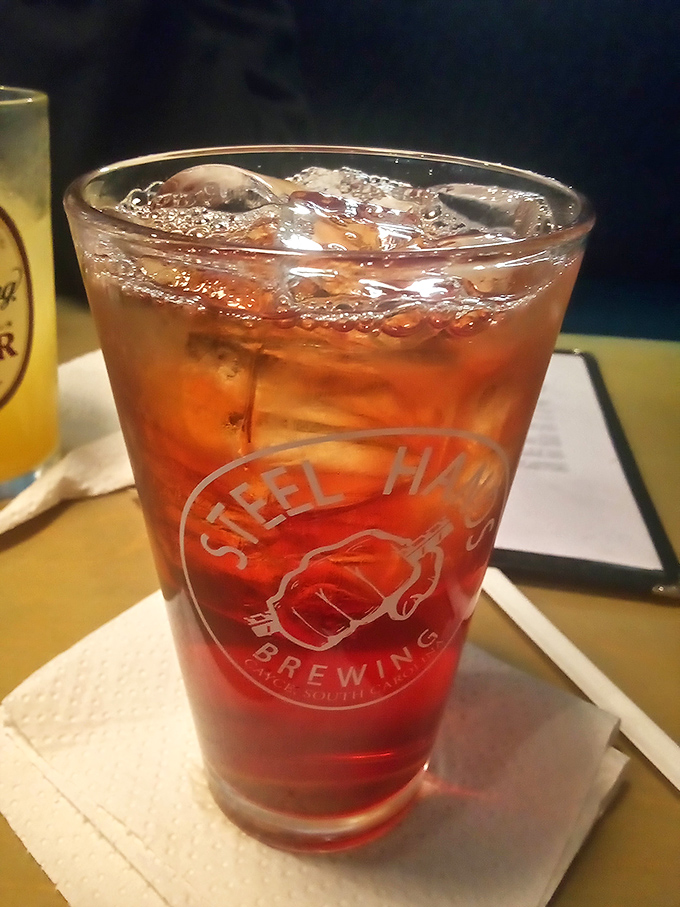 A proper Southern sweet tea in a Steel Hands Brewing glass&mdash;because hydration is important when embarking on serious burger business.