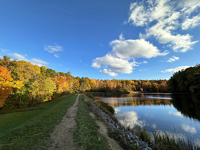 Autumn paints Sylvan Pond with a palette that would make Bob Ross weep with joy&mdash;nature's masterpiece reflected in perfect stillness.