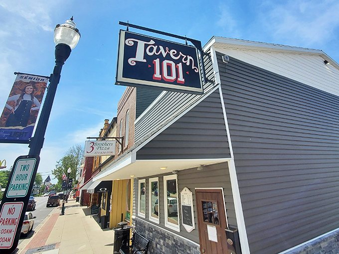 Tavern 101 beckons with its classic signage, promising the kind of local watering hole where everybody might actually know your name.