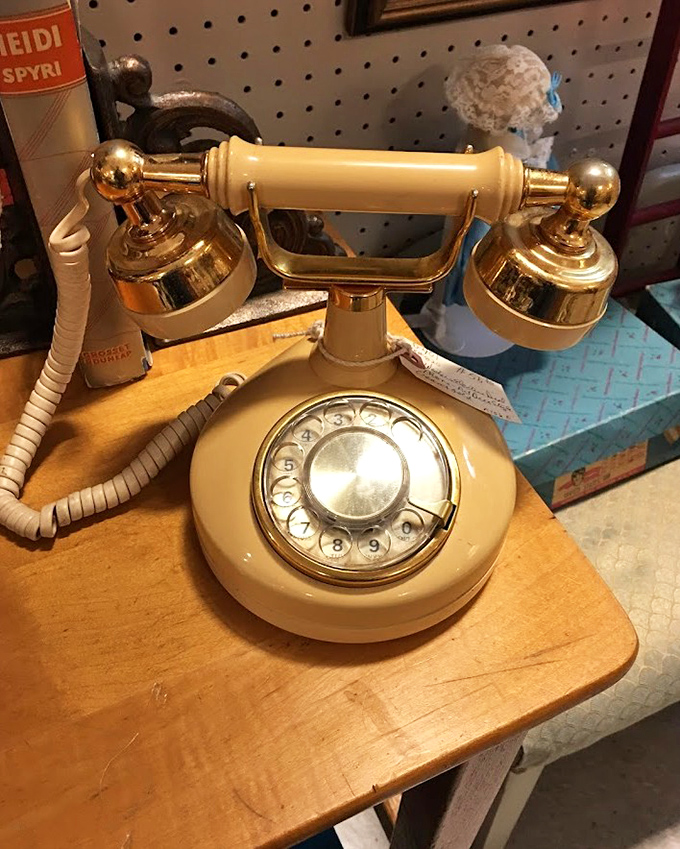 This elegant cream telephone once connected families across distances. Now it connects generations across time with rotary-dial nostalgia.