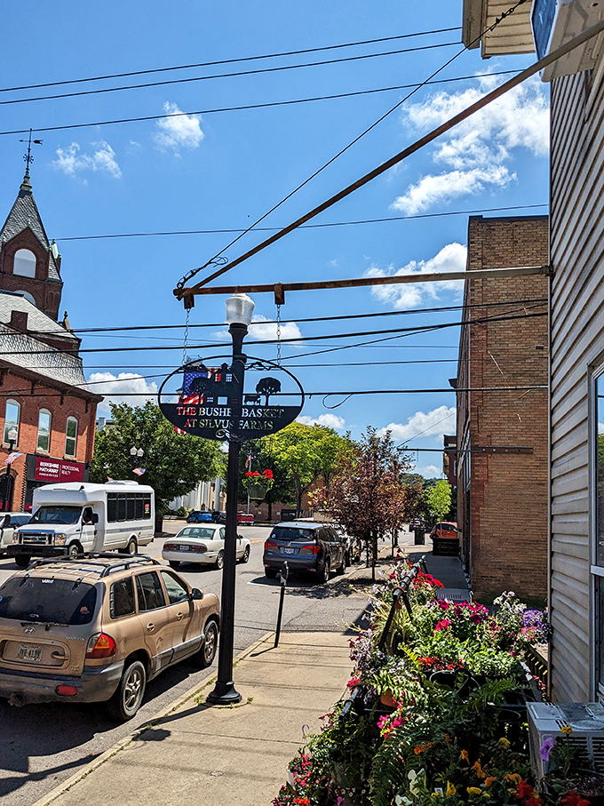The fairground's Ferris wheel illuminates the twilight, a reminder that small-town celebrations create memories that last far longer than the ride.