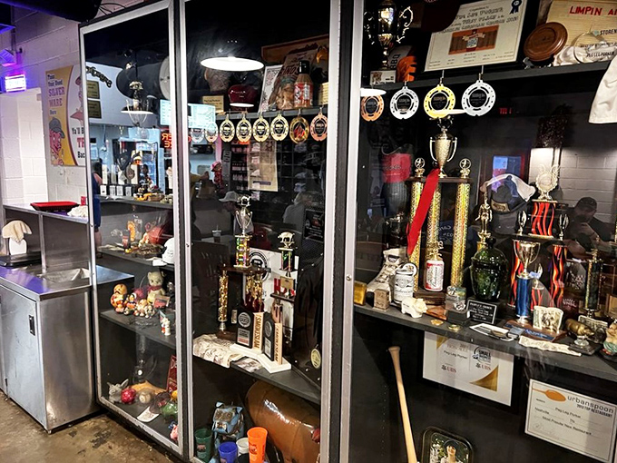 The trophy case tells stories of smoke-filled competitions and blue ribbons, each award a chapter in Peg Leg's delicious legacy.
