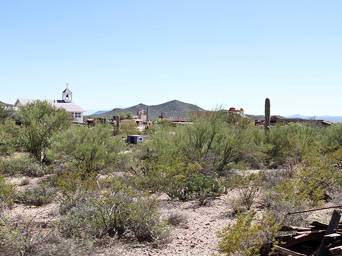 The Tucson Mountains provide the perfect backdrop for this frontier town, their jagged silhouette unchanged since the days of actual cowboys and outlaws.