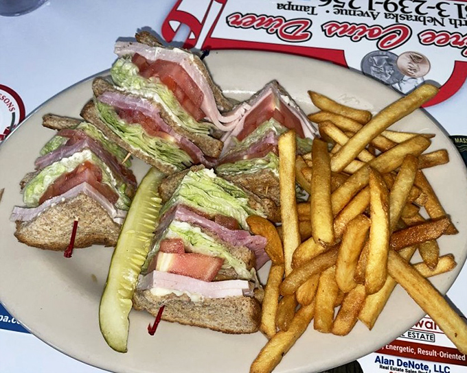 The club sandwich: three stories of deliciousness held together by those fancy toothpicks you're definitely not supposed to swallow.