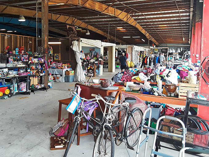 Organized chaos reigns supreme where bicycles mingle with household mysteries in the most delightful retail confusion.