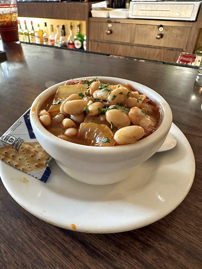 A bowl of comfort that warms from the inside out. Those white beans swimming in savory broth are like little life rafts for your soul.