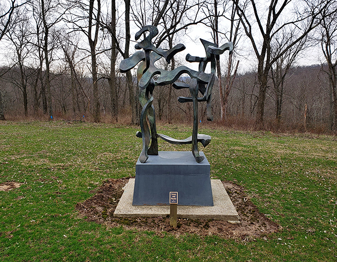 Dark against winter's bare trees, this abstract sculpture dances with negative space, turning Ohio's gray skies into the perfect dramatic backdrop.