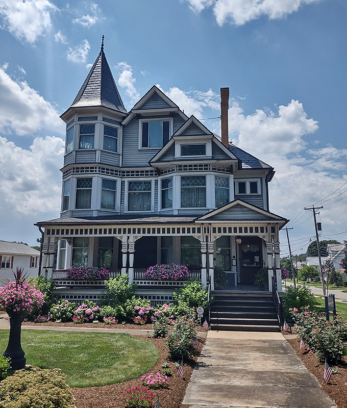 This magnificent Victorian mansion with its turret and wrap-around porch looks like it's waiting for someone to arrive in a horse-drawn carriage.
