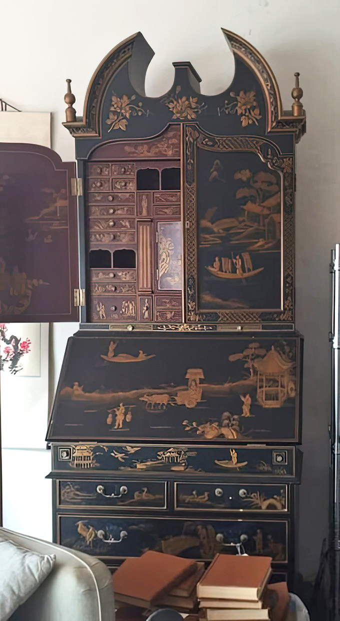 This ornate Asian-inspired cabinet isn't just furniture; it's functional art with drawers full of possibilities and a history written in its patina.