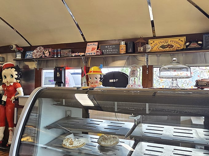 The dessert case guarded by vintage Betty Boop figurines &ndash; silent sentinels protecting pies that would make your grandmother both proud and jealous.