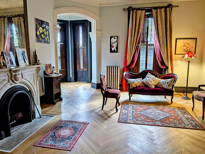 Elegant archways and herringbone floors lead visitors through rooms that feel like chapters in a particularly stylish historical novel.