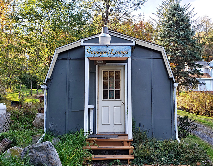 The charmingly named "Voyagers' Lounge" offers shelter for weary wanderers. This little blue building has probably heard more profound thoughts than most philosophy departments.