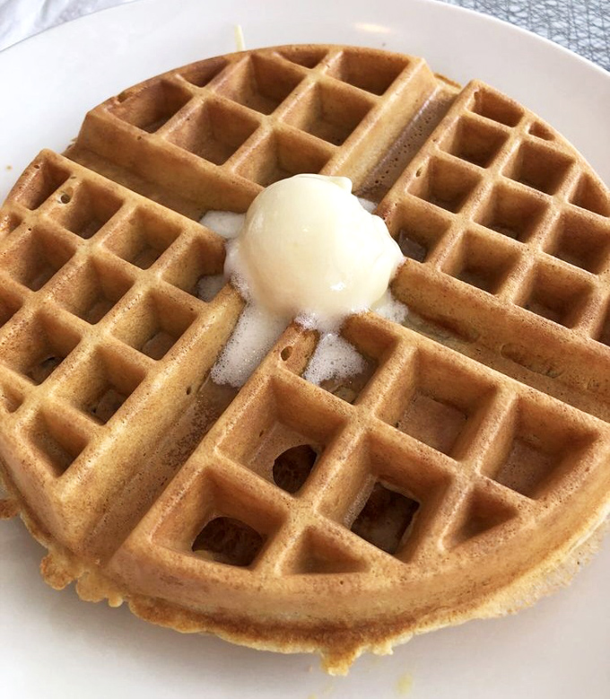 This waffle's perfect grid pattern isn't just satisfying&mdash;it's creating little pools of butter and syrup that make mathematicians and food lovers equally happy. 