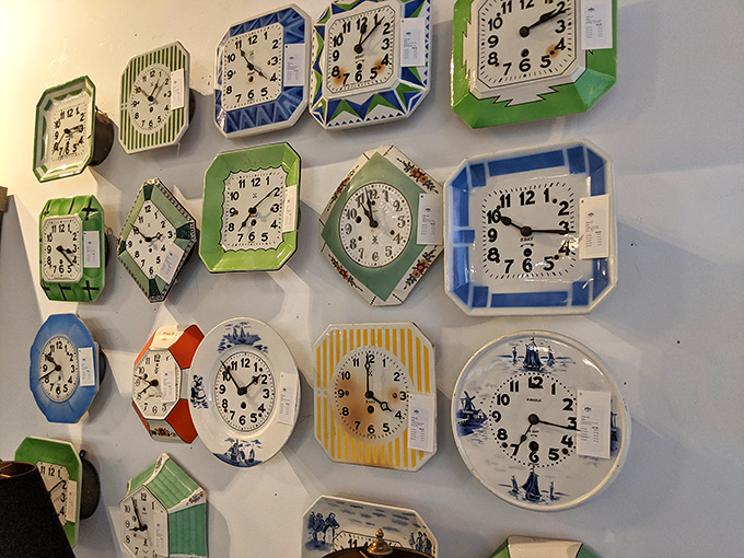 A constellation of vintage clocks, each frozen at a different moment, creating a wall where it's always time for something wonderful.