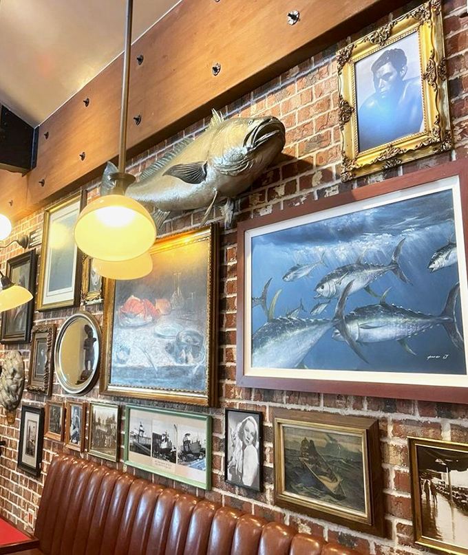 The brick walls serve as a maritime gallery, where fish mounts and nautical paintings create an atmosphere that's equal parts homage to the sea and comfortable neighborhood joint.