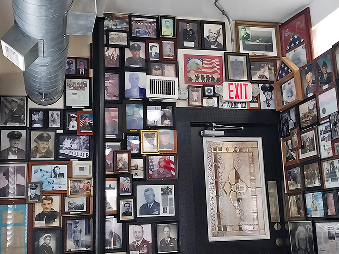 Not just decoration&mdash;a wall of honor showcasing military service, creating a dining room that feels more like a community living room.