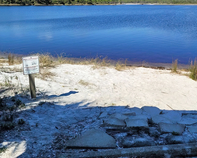 Western Lake's blue serenity: The rare coastal dune lake shimmers like a sapphire set in white sand, creating a paddler's paradise.